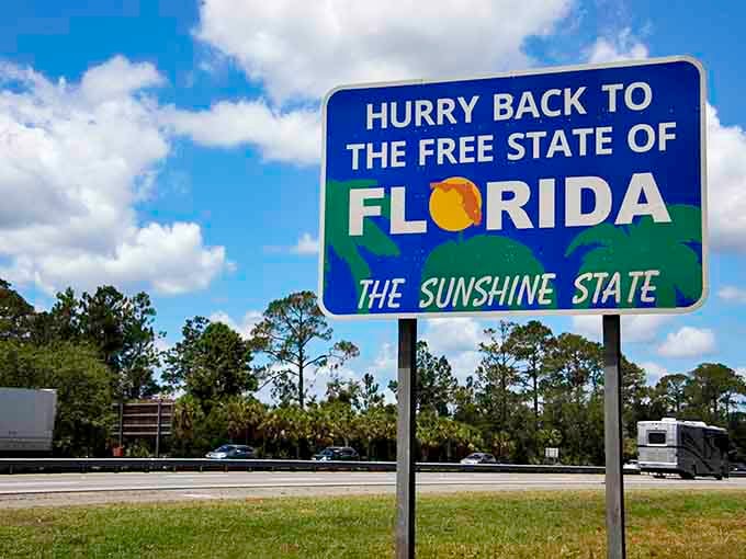 That blue and green beauty standing tall against the sky is pure Florida poetry in sign form.