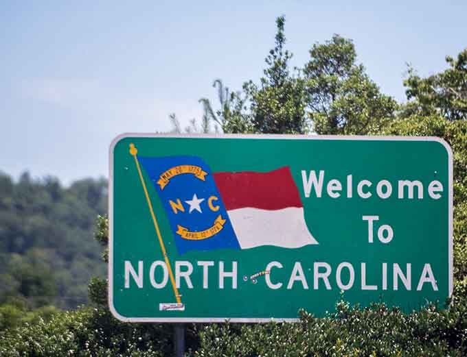 This friendly sign welcomes you to North Carolina, a beautiful place filled with wonderful adventures for everyone to enjoy today.