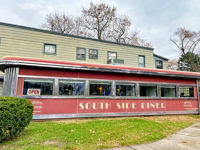 That burgundy and cream exterior isn't just a building, it's a time machine with a parking lot.