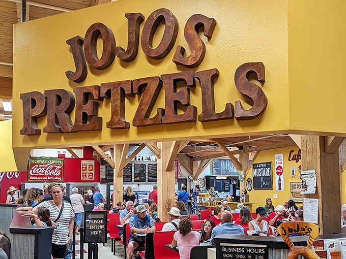 Those carved wooden letters aren't messing around, announcing pretzel paradise like a delicious Broadway marquee above happy diners.