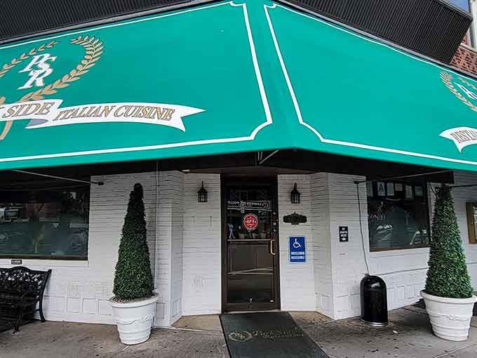 That green awning isn't just decoration, it's a beacon calling you to one of Queens' best-kept culinary secrets.