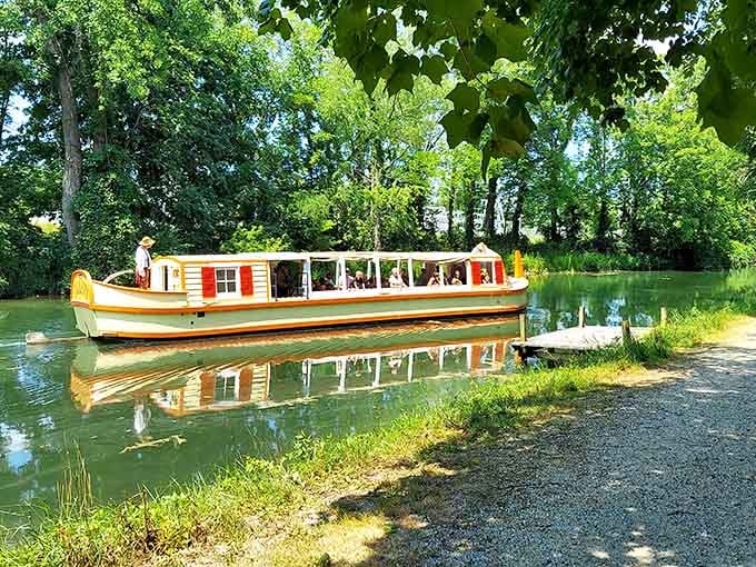 That cheerful canal boat isn't just floating there, it's your ticket to experiencing history at a gloriously unhurried pace.