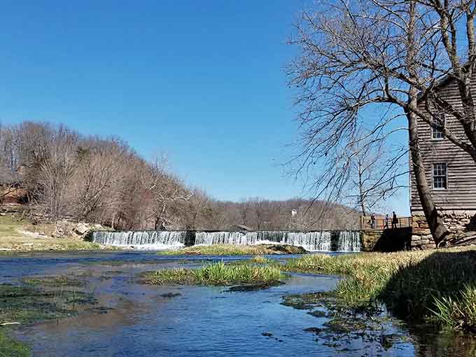 Capps Creek flows past the historic mill, creating the kind of postcard scene that makes you forget smartphones exist.