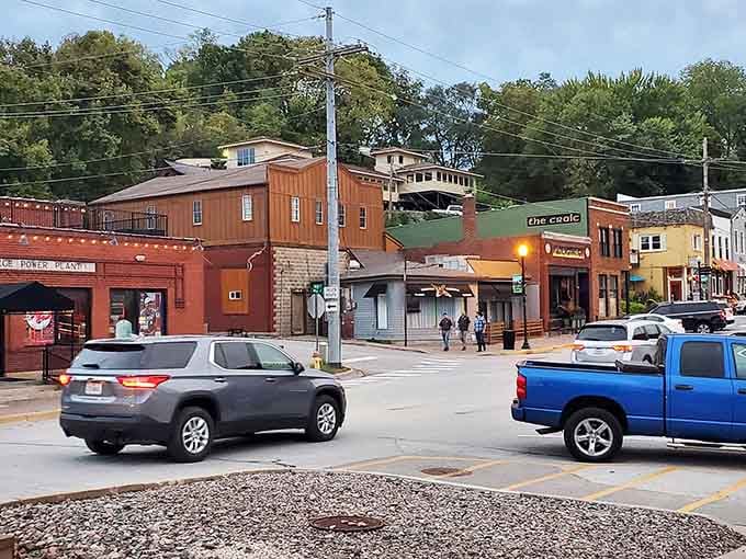 Watch closely as storefronts cascade down the bluff, each level revealing another era of brick-and-mortar charm.