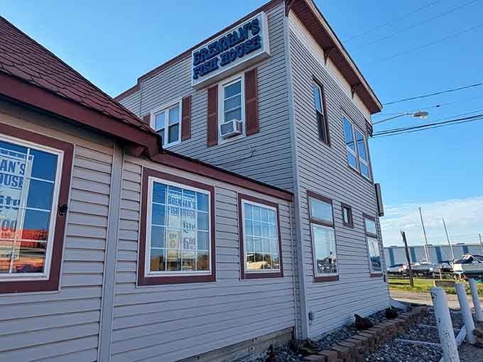 Those sailboat masts peeking behind the building whisper promises of fresh catches and salty air.
