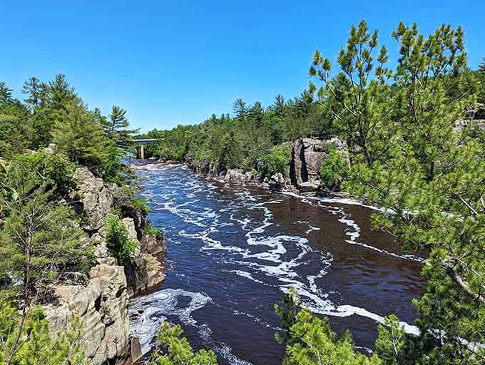 When summer sunshine hits these towering cliffs, the rushing river becomes a swirling masterpiece of white-capped beauty.