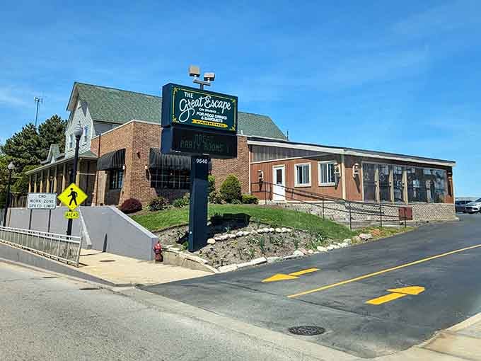 The brick facade and inviting awning, seen from the street, feel like a cozy home ready to greet you.