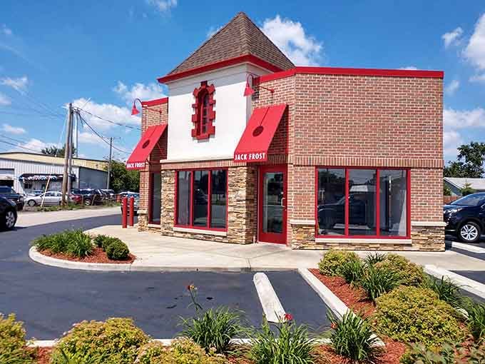 That distinctive red and white exterior isn't just charming, it's a beacon calling donut lovers home.