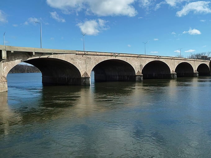 Those arches reflecting in the water create a symmetry so perfect it belongs on a postcard.