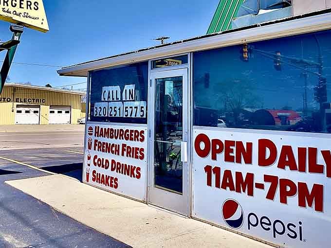 The bright blue exterior and classic lettering promise exactly what's written: hamburgers, fries, shakes, and pure satisfaction.