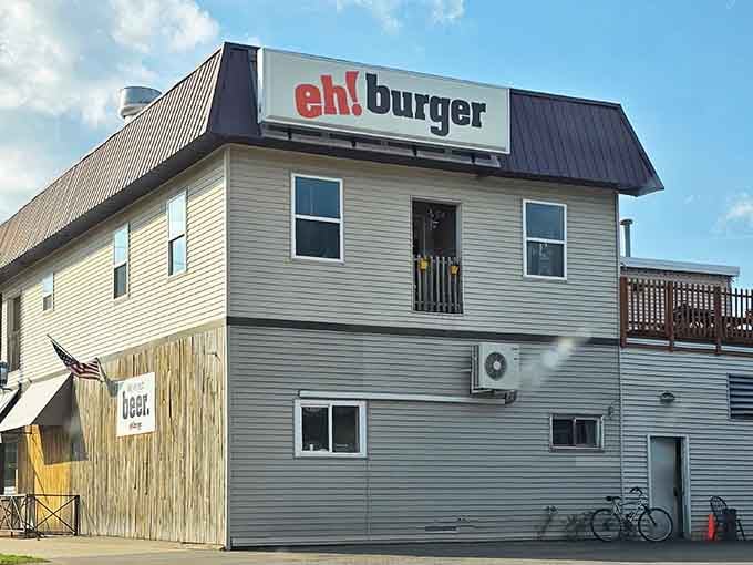 That bold red signage against the Upper Peninsula sky isn't just announcing a restaurant &ndash; it's declaring a burger revolution.