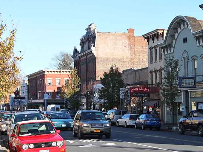 Historic brick buildings line streets where every storefront tells a story worth discovering on foot.