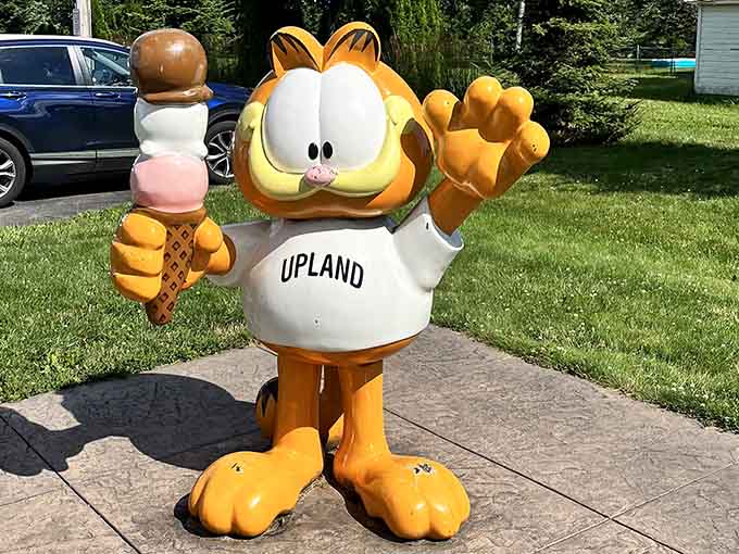 The Upland Garfield welcomes visitors with ice cream in hand, because nothing says small-town Indiana like frozen treats.