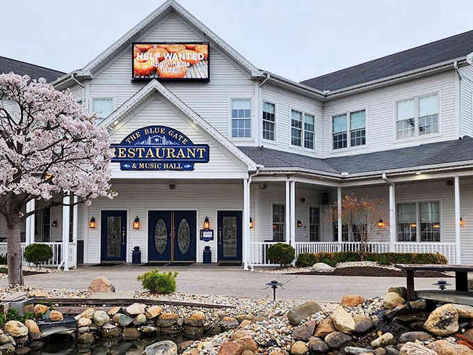 Cherry blossoms and a peaceful pond create an entrance worthy of a Sunday drive destination.