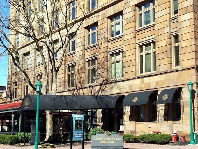 A beautiful historic stone building with elegant black awnings awaits you for a legendary brunch experience that you will adore.