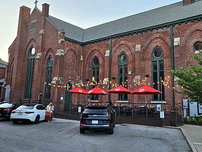 That red brick Gothic Revival exterior isn't just beautiful, it's basically architectural proof that someone had excellent taste back in the day.
