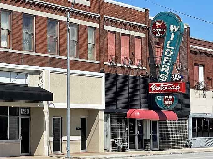 That neon sign has been calling hungry souls to Main Street longer than most GPS systems have existed.