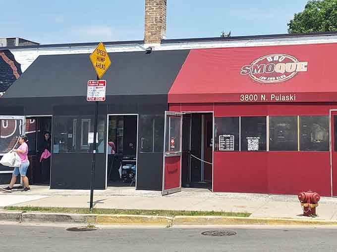 That red awning beckons like a lighthouse for hungry souls, promising smoky salvation at 3800 North Pulaski Avenue.