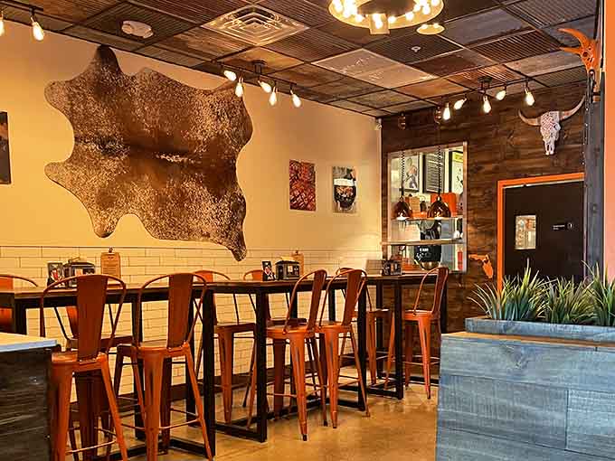 That cowhide on the wall isn't just decoration; it's a promise of the smoky goodness awaiting you inside.