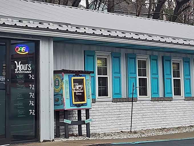 Those turquoise shutters aren't just decoration; they're a promise that something wonderful awaits inside this charming diner.