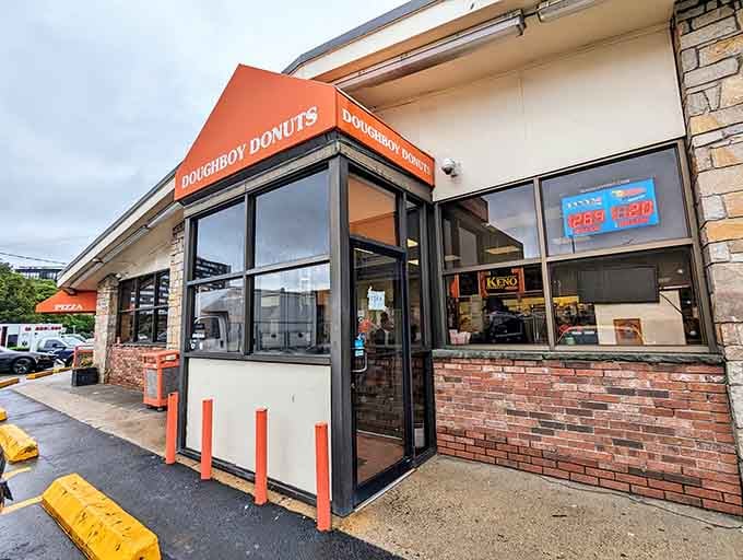 That orange awning isn't just decoration, it's a beacon of hope for anyone craving seriously oversized apple fritters.