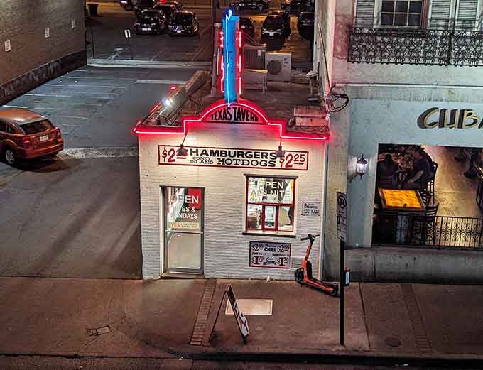 That neon glow at night isn't just a sign, it's a beacon calling hungry souls to affordable salvation.