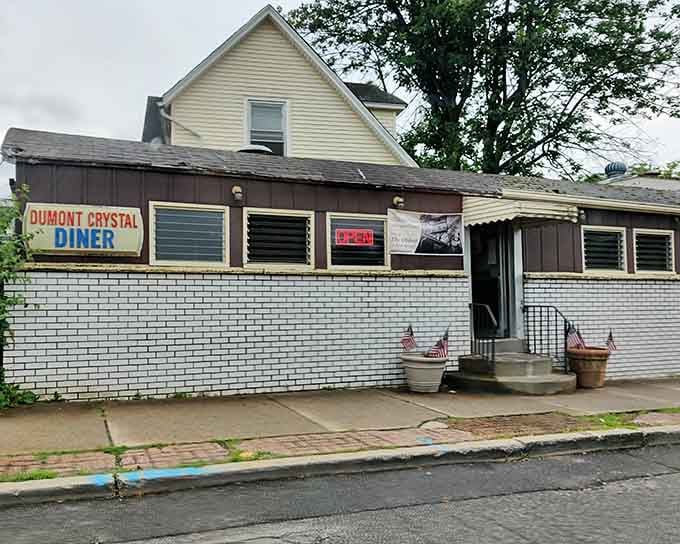That white-painted exterior might look modest, but this unassuming building holds the title of New Jersey's oldest operating diner.