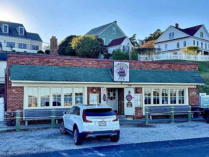 That brick facade and gravel parking lot are your first clue that something special awaits inside this Yorktown gem.