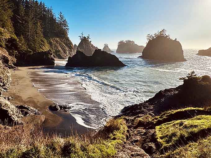 Secret Beach reveals itself like nature's best-kept surprise, complete with dramatic sea stacks and pristine sand.