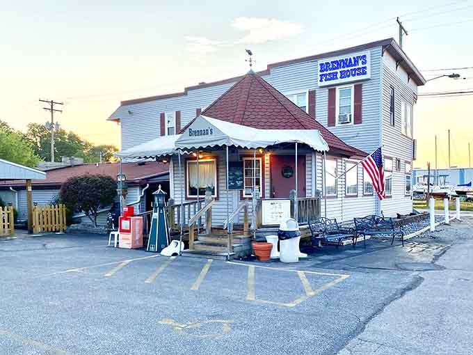 The red roof and white siding create that classic New England fish shack aesthetic we all crave.