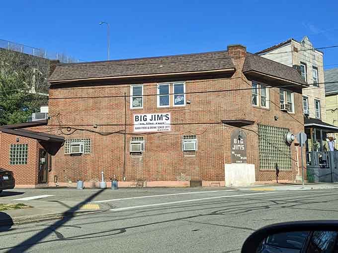 That classic brick corner building isn't trying to impress anyone, and that's exactly why it does.