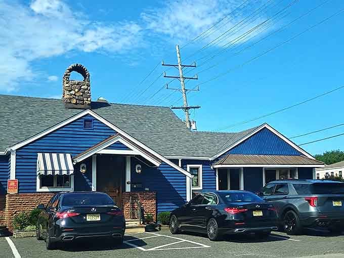 That blue clapboard exterior and stone anchor aren't just for show, they're your first clue something good awaits inside.