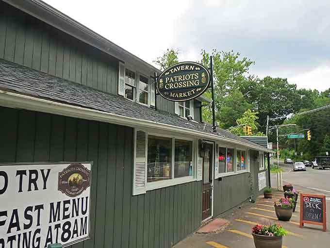 That green exterior and welcoming sign practically beg you to pull over and stay awhile.