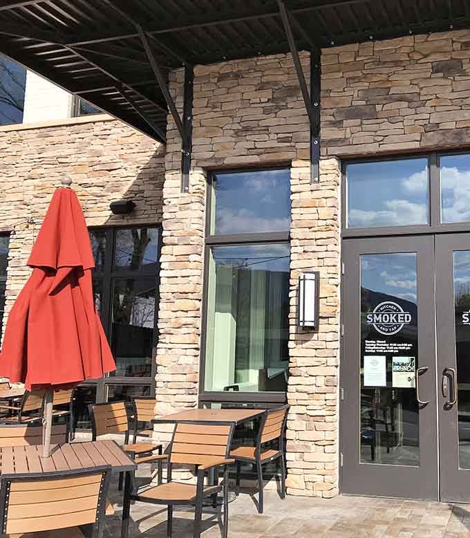 That stacked stone exterior and welcoming patio practically whisper "come in, we've got the good stuff waiting."