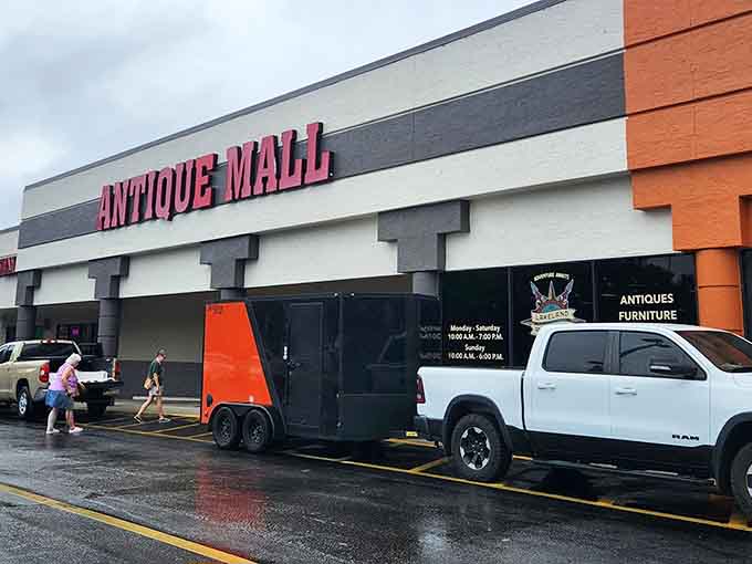 That pink "ANTIQUE MALL" sign isn't subtle, and honestly, why should it be when treasure awaits inside?