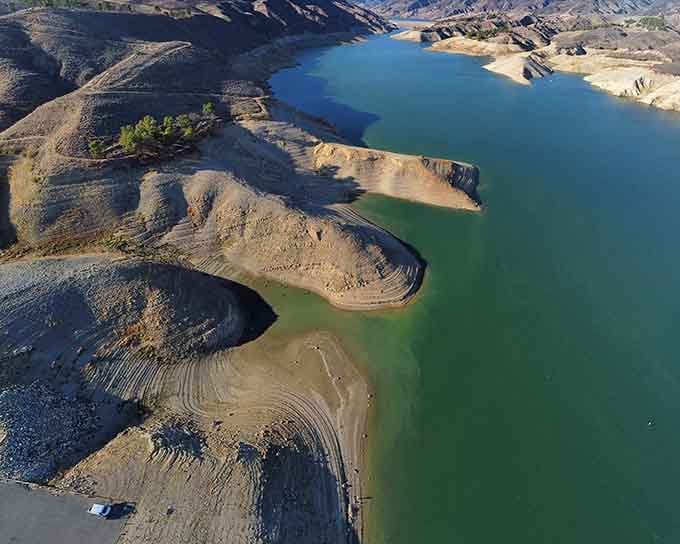 The aerial perspective shows just how vast this aquatic playground really is, stretching between sun-baked mountains like nature's infinity pool.