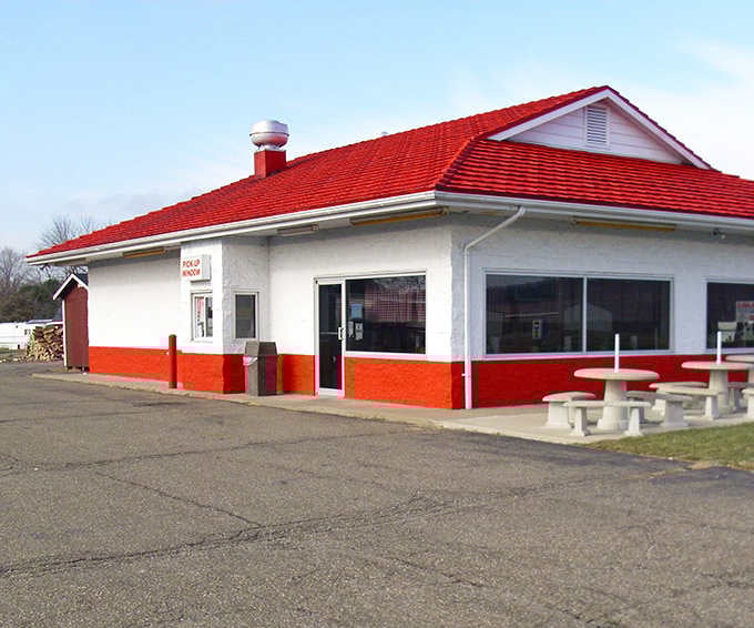 That bright red roof isn't just decoration, it's a beacon calling hungry travelers to barbecue salvation.