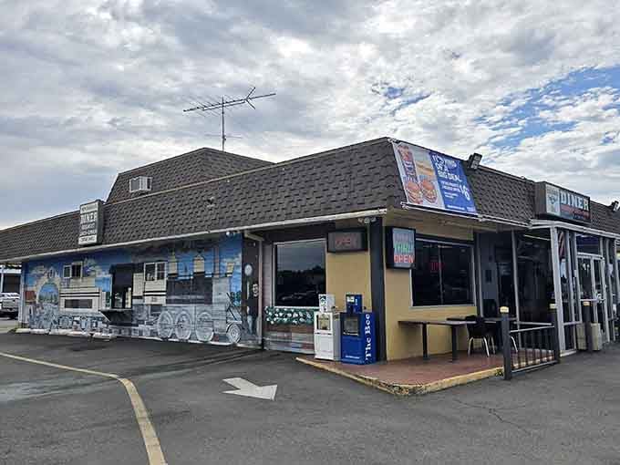 That charming train mural outside hints at the locomotive magic waiting inside this beloved Lodi treasure.
