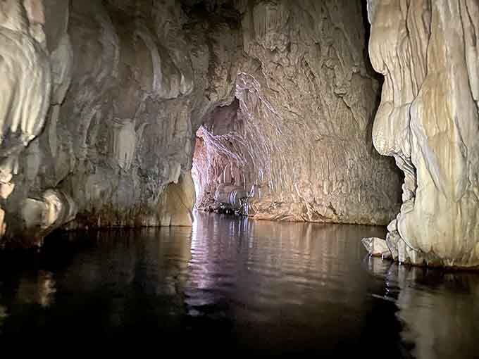 The main chamber reveals limestone walls sculpted by millennia of patient water, creating nature's own architectural masterpiece underground.