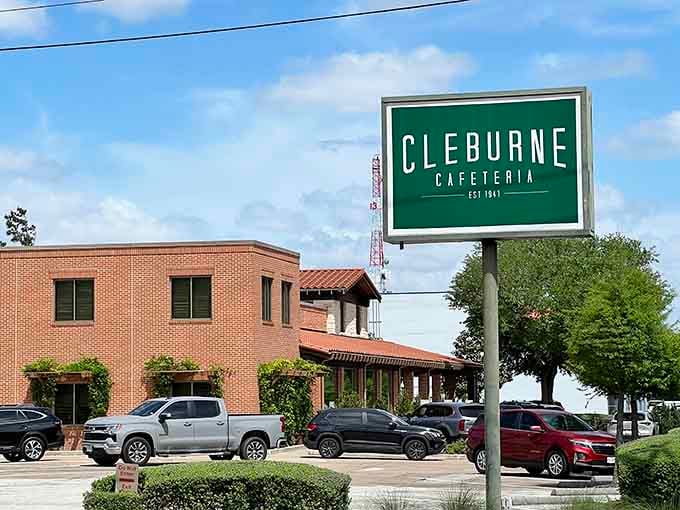 That classic green Cleburne Cafeteria sign is your beacon to home-cooked meals, where turkey and dressing await you every single day.