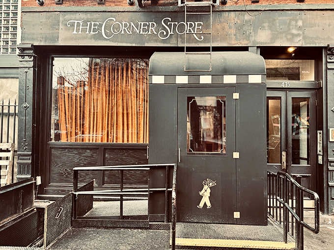 That unassuming entrance hides one of SoHo's hottest dining destinations, where velvet curtains guard culinary treasures within.