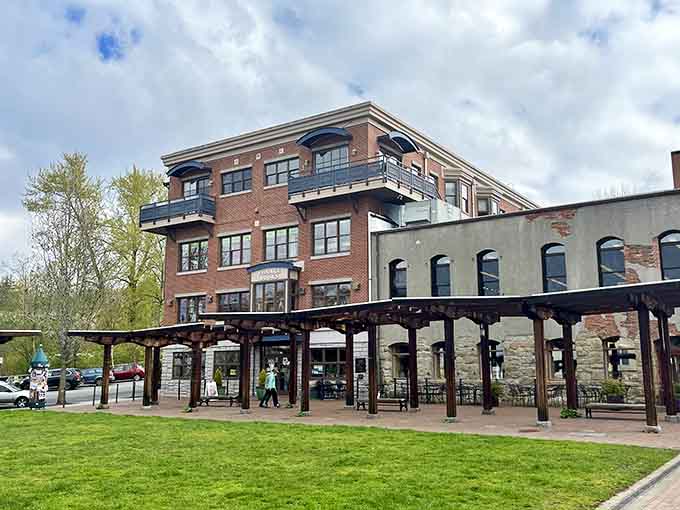 Village Books and Paper Dreams welcomes you with brick charm and outdoor seating perfect for literary adventures.