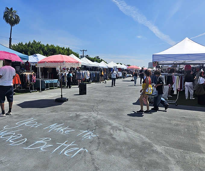 The outdoor market buzzes with treasure hunters under California blue skies, where every tent hides potential vintage gold.