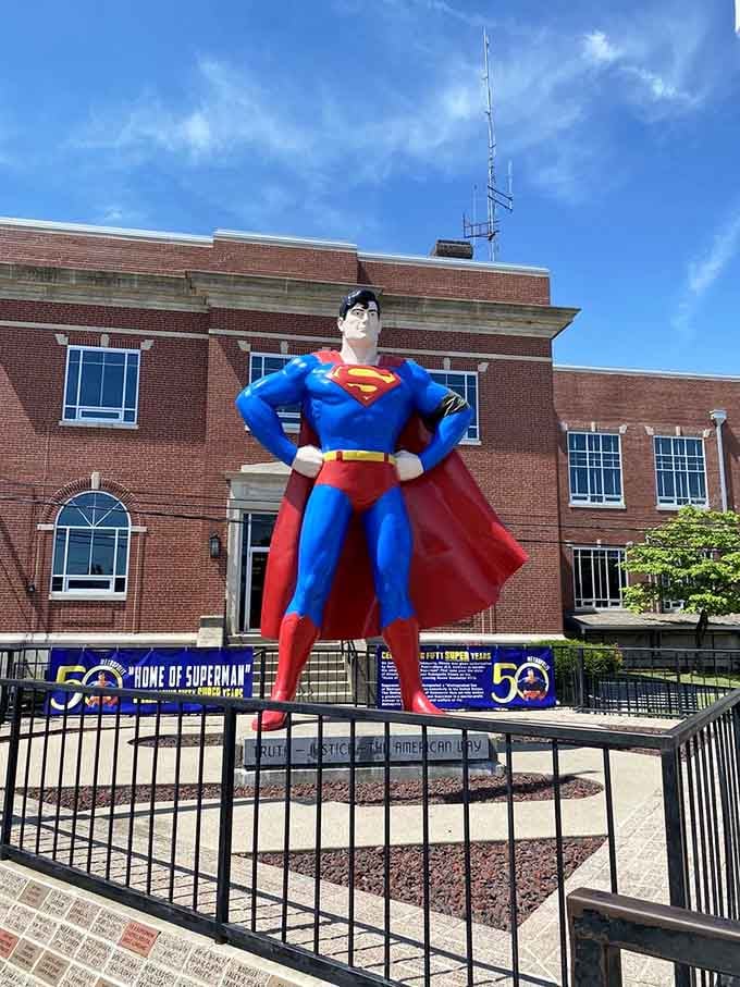 Standing 15 feet tall in brilliant blue and red, this bronze hero makes every visitor feel like a kid again.