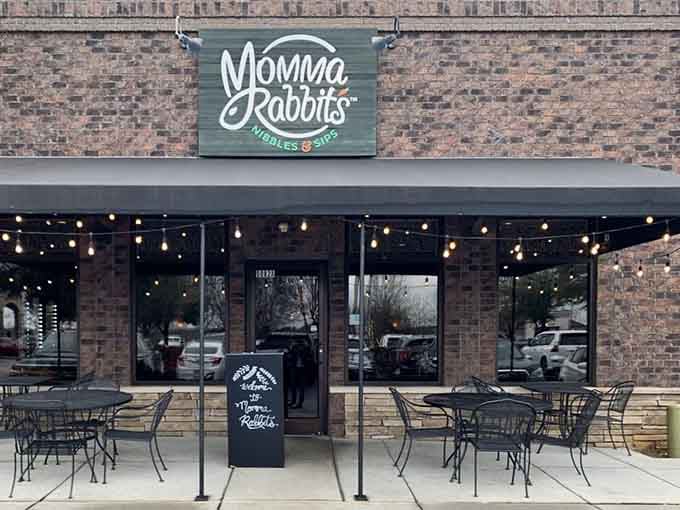 That green sign against brick is your beacon to breakfast bliss, complete with twinkling lights that say "stay awhile."