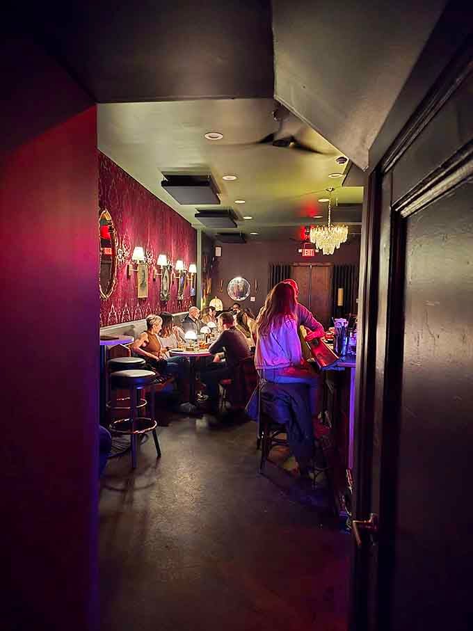 Step through the looking glass into a world where velvet seating and crystal chandeliers make every night feel special.