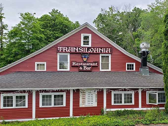 That red barn exterior promises antiques but delivers vampires, proving Connecticut's best surprises hide in plain sight.