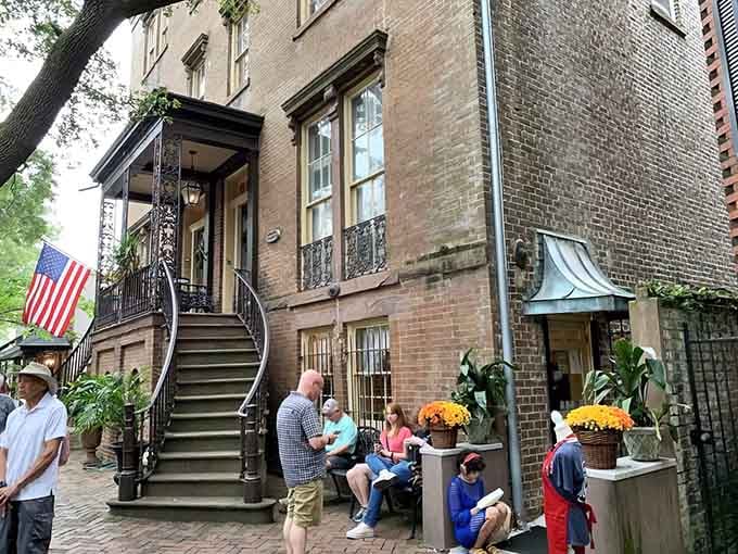 That historic brick facade and those welcoming stairs are your gateway to Southern food paradise in downtown Savannah.