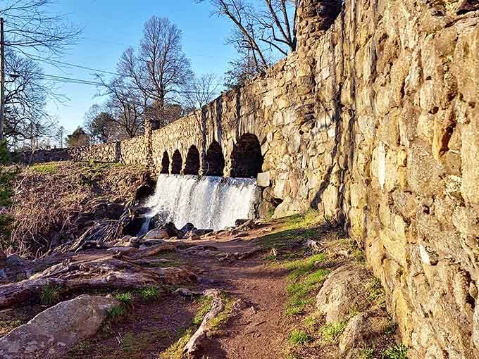 Those stone arches cascading with water look like something from a Roman aqueduct, minus the togas.