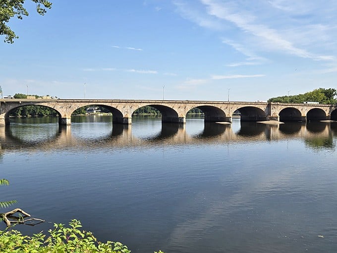 Those arches reflecting in the water create a symmetry so perfect it belongs on a postcard.